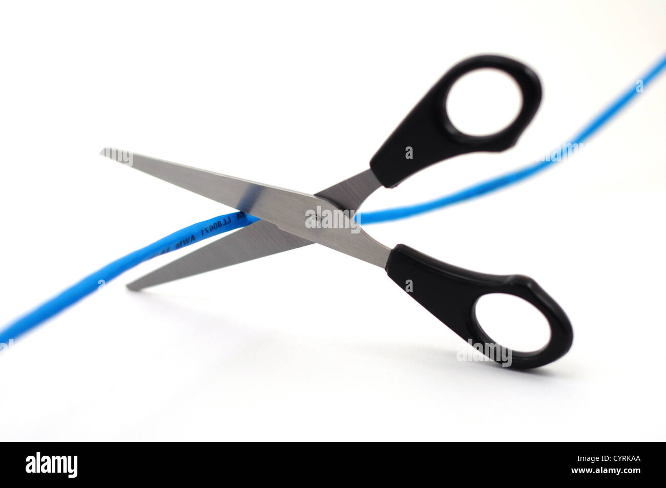 internet addiction concept with scissors and blue network cable on ...
