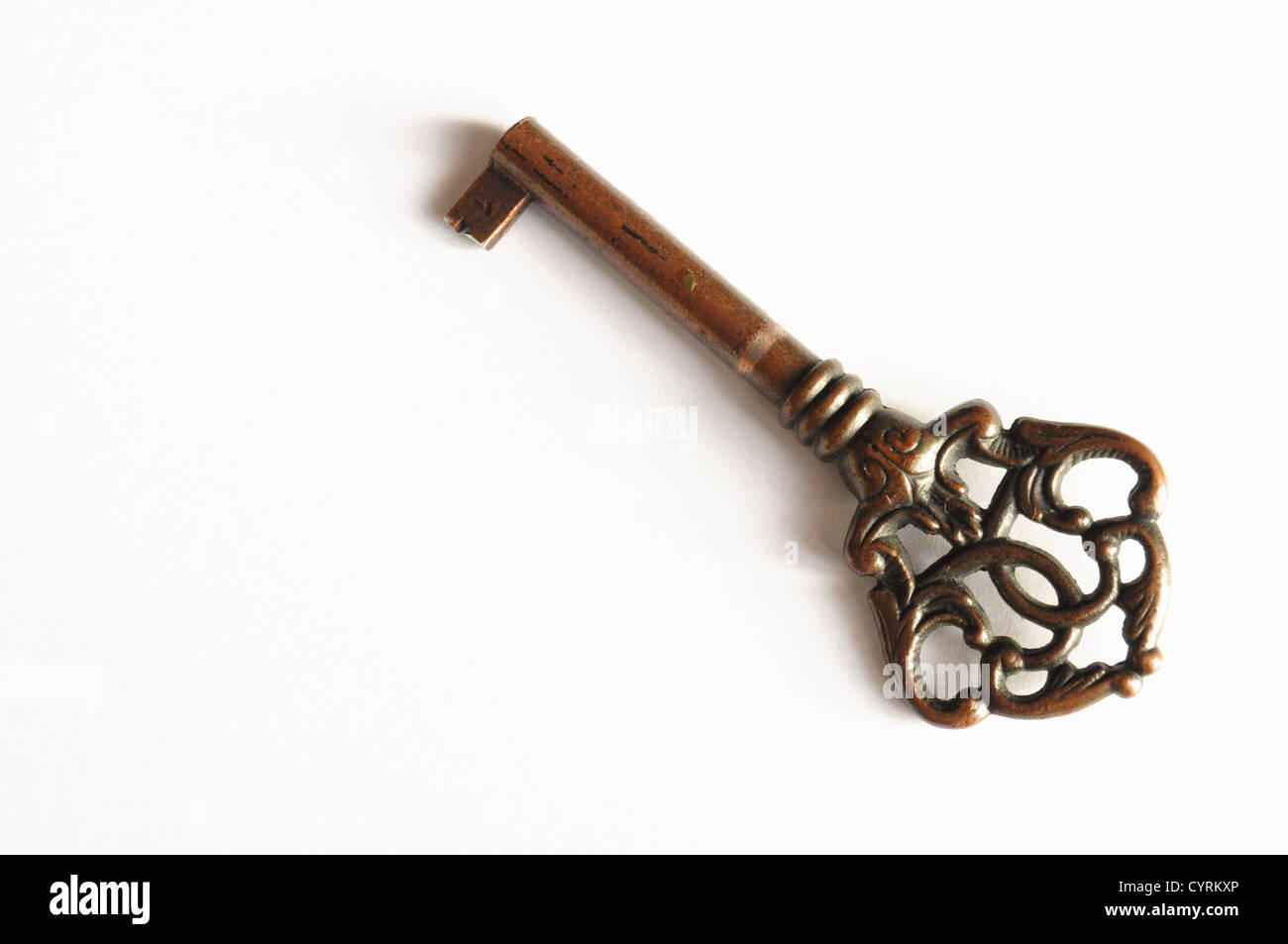 old vintage key isolated on a white background Stock Photo - Alamy