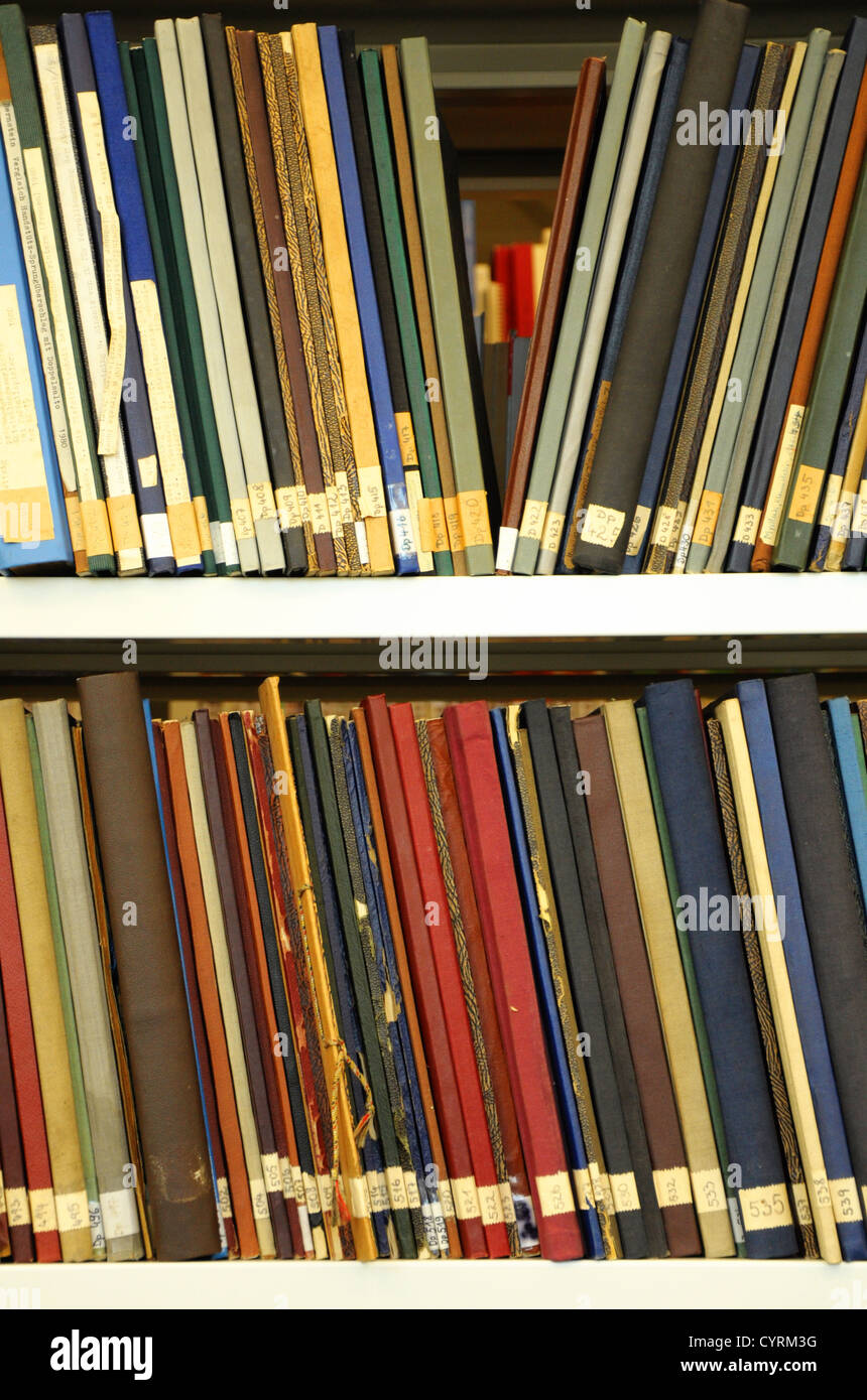 book in a library book shelf showing study concept Stock Photo - Alamy