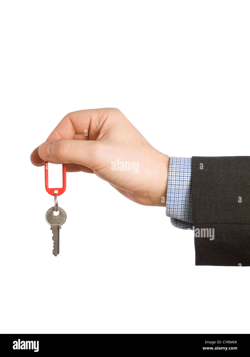 A hand holding a red keyring with a blank label and a key Stock Photo ...