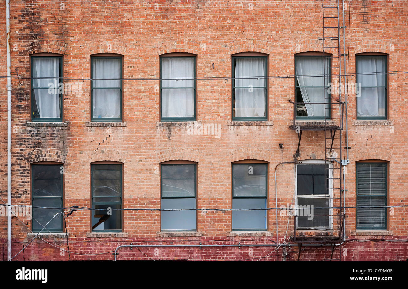 Many windows on a brick building from the 1800s in Bisbee Arizona Stock ...