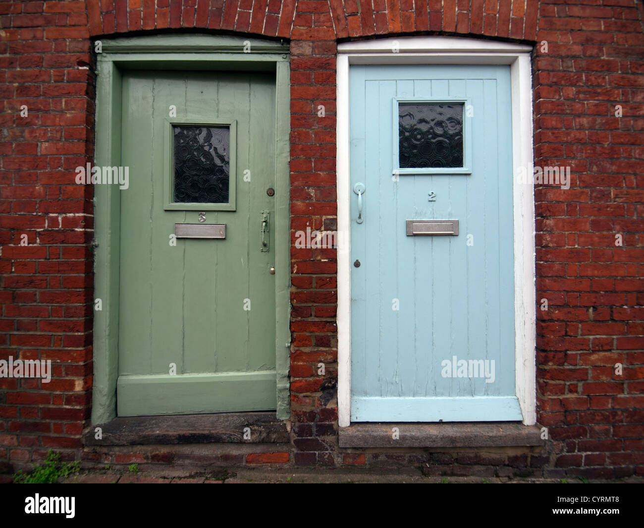The front of two terraced cottages in the pretty East Sussex village of ...