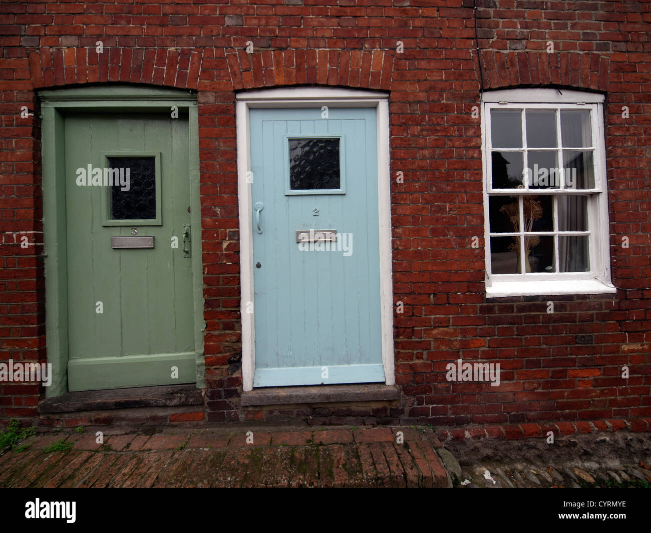 The front of two terraced cottages in the pretty East Sussex village of ...