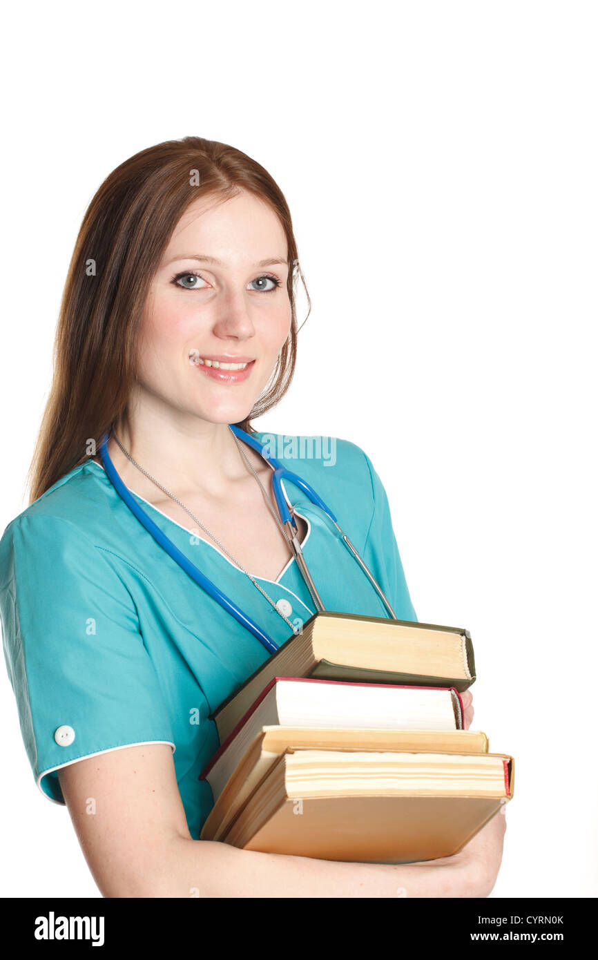 The portrait of kind female doctor in the green uniform with books ...