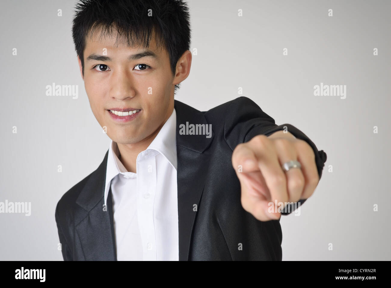Young business man pointing out towards you with smiling face Stock ...