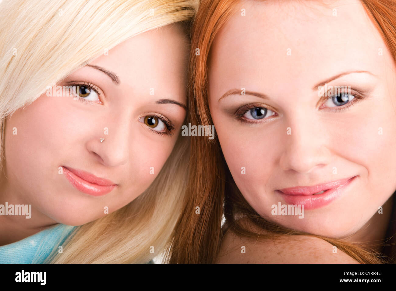 Closeup photo of two teenager girls smiling faces Stock Photo - Alamy