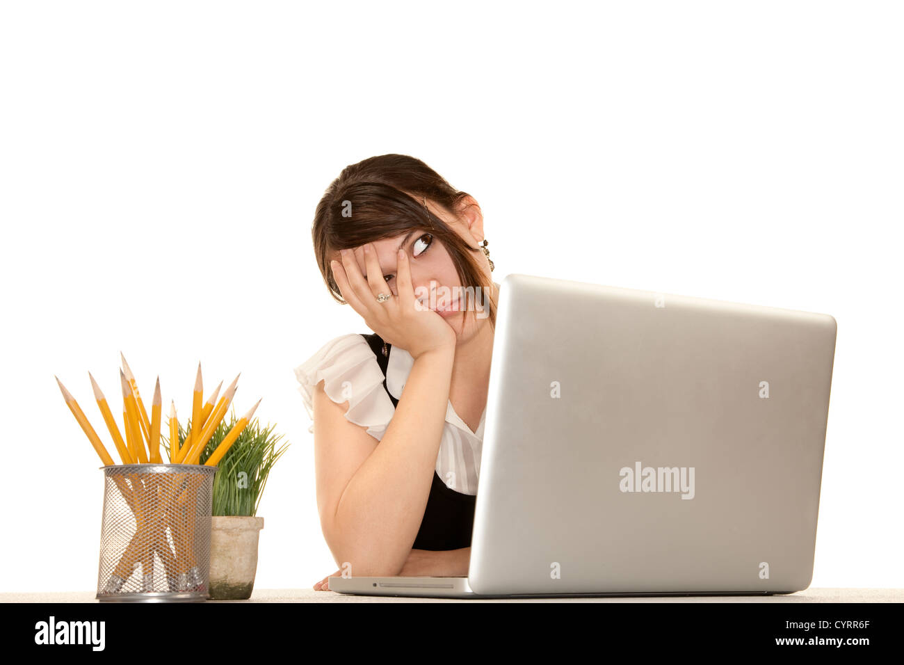 Pretty female office worker with laptop computer Stock Photo - Alamy