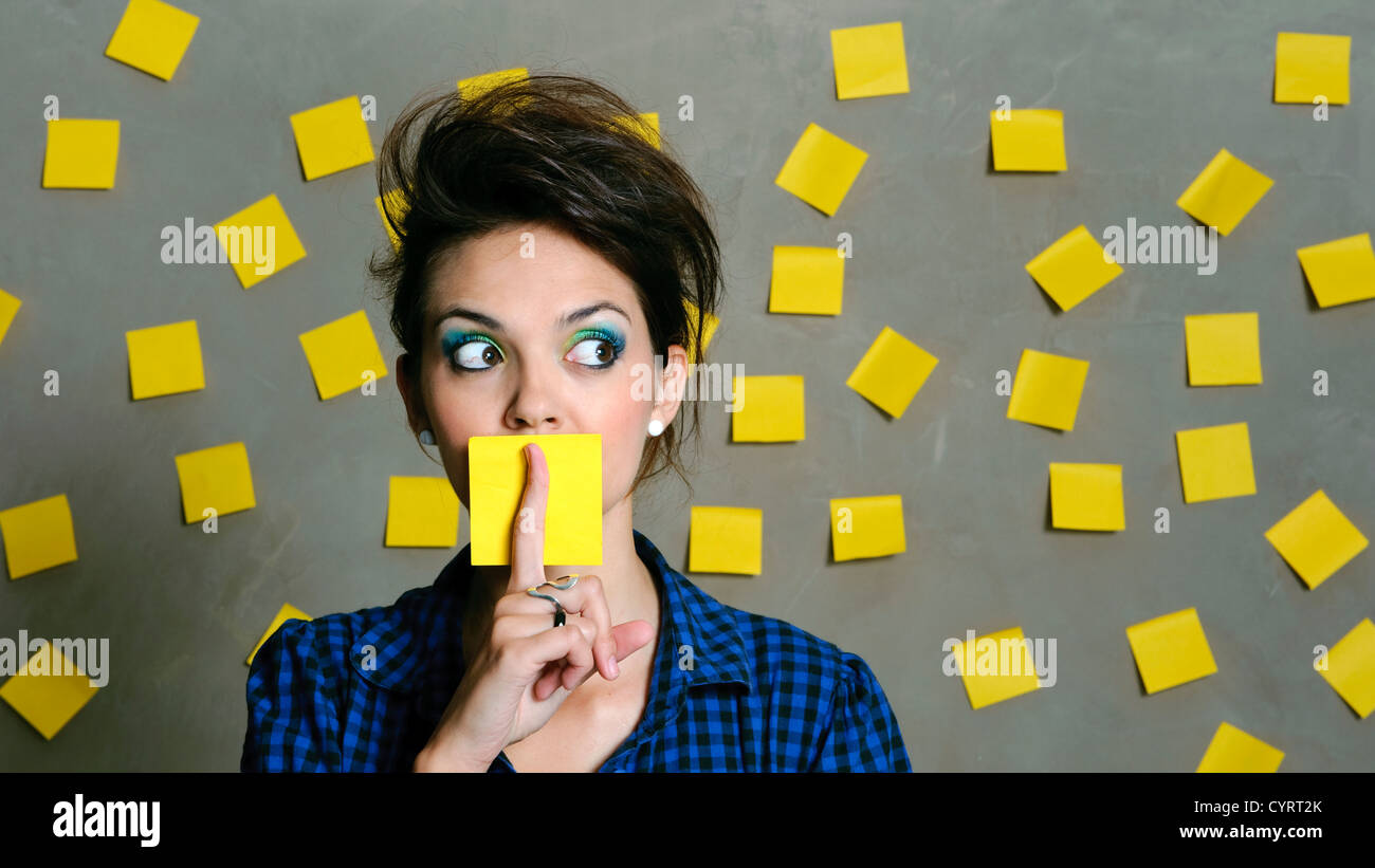 Pretty fashion model with hundreds of post it notes Stock Photo - Alamy