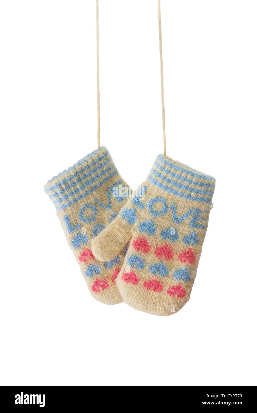 Hanging baby mittens isolated on white background Stock Photo - Alamy
