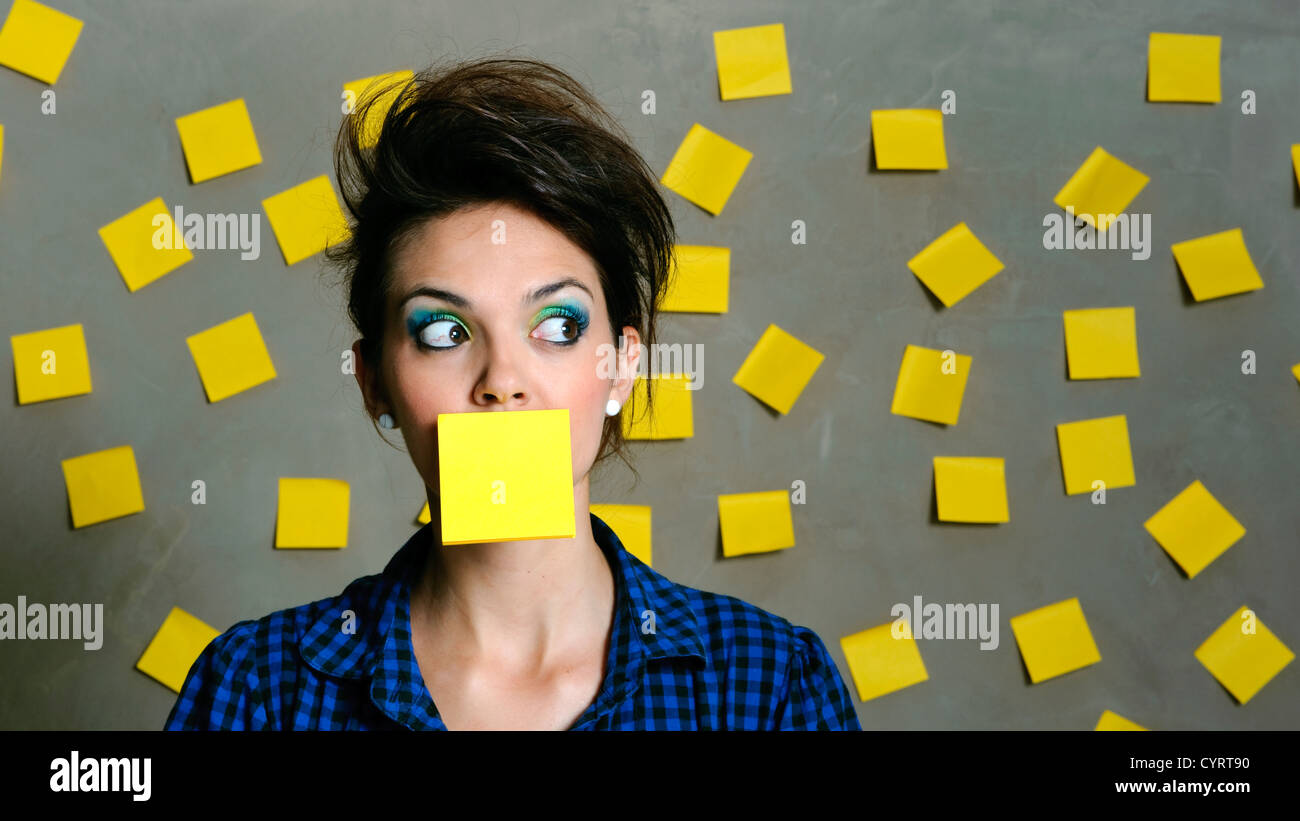Pretty fashion model with hundreds of post it notes Stock Photo - Alamy