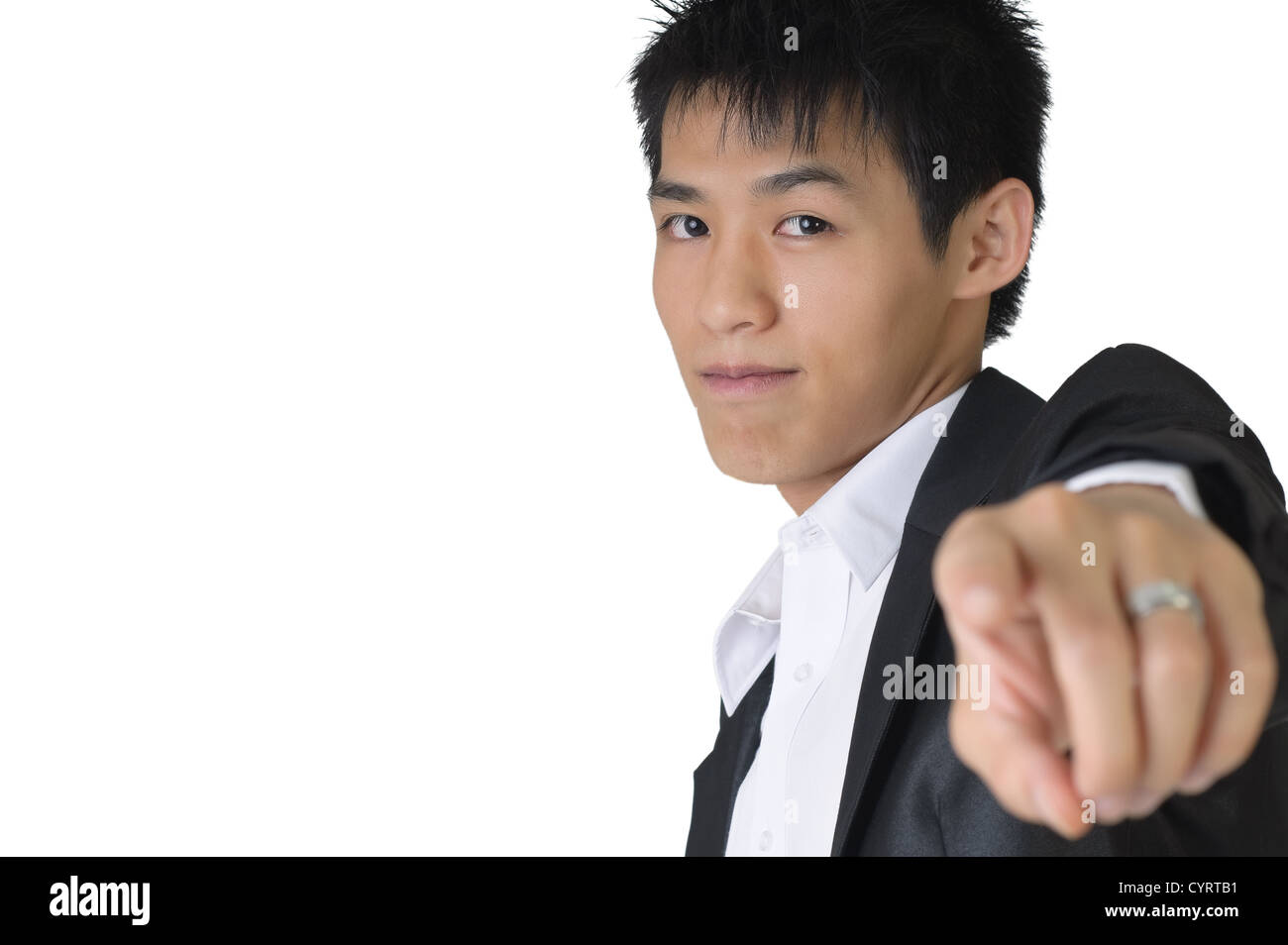 Confident business man pointing out towards you on white background ...