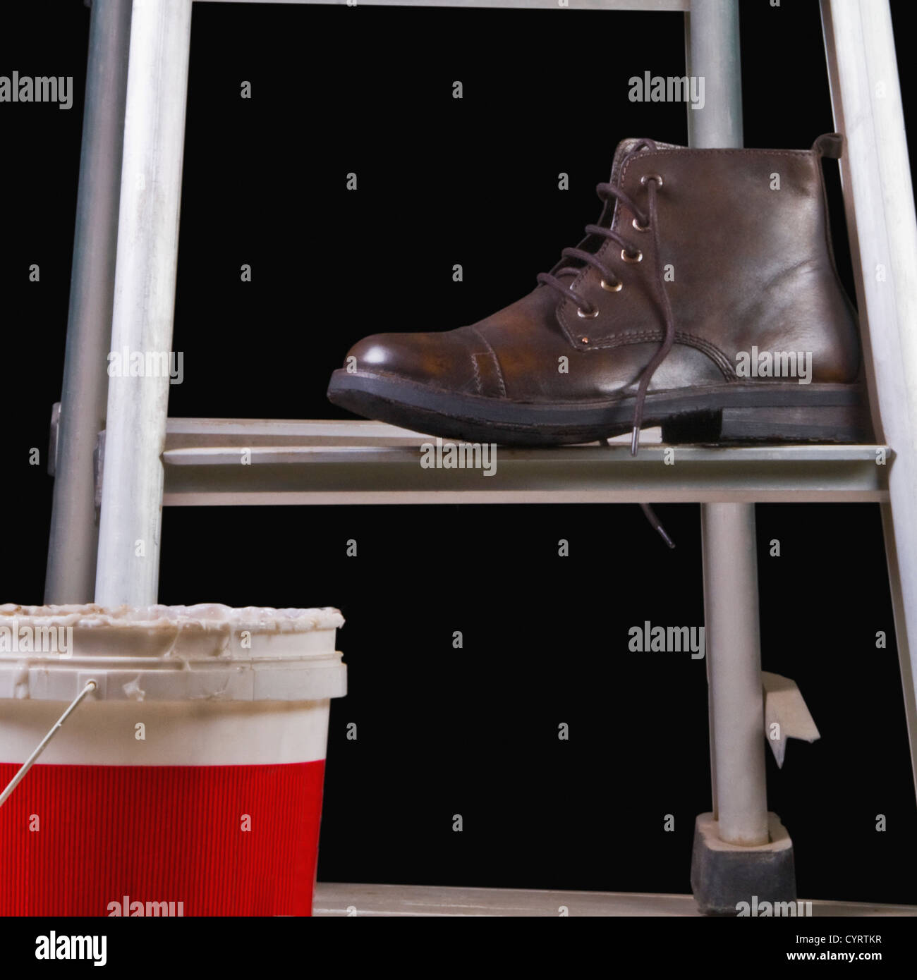 Leather boot on a step ladder Stock Photo - Alamy