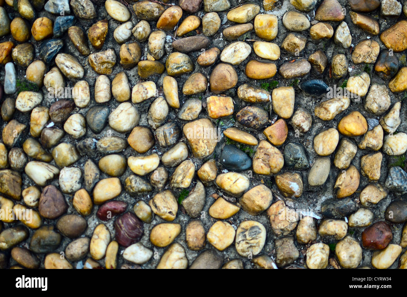 Pebble stone wall background Stock Photo - Alamy