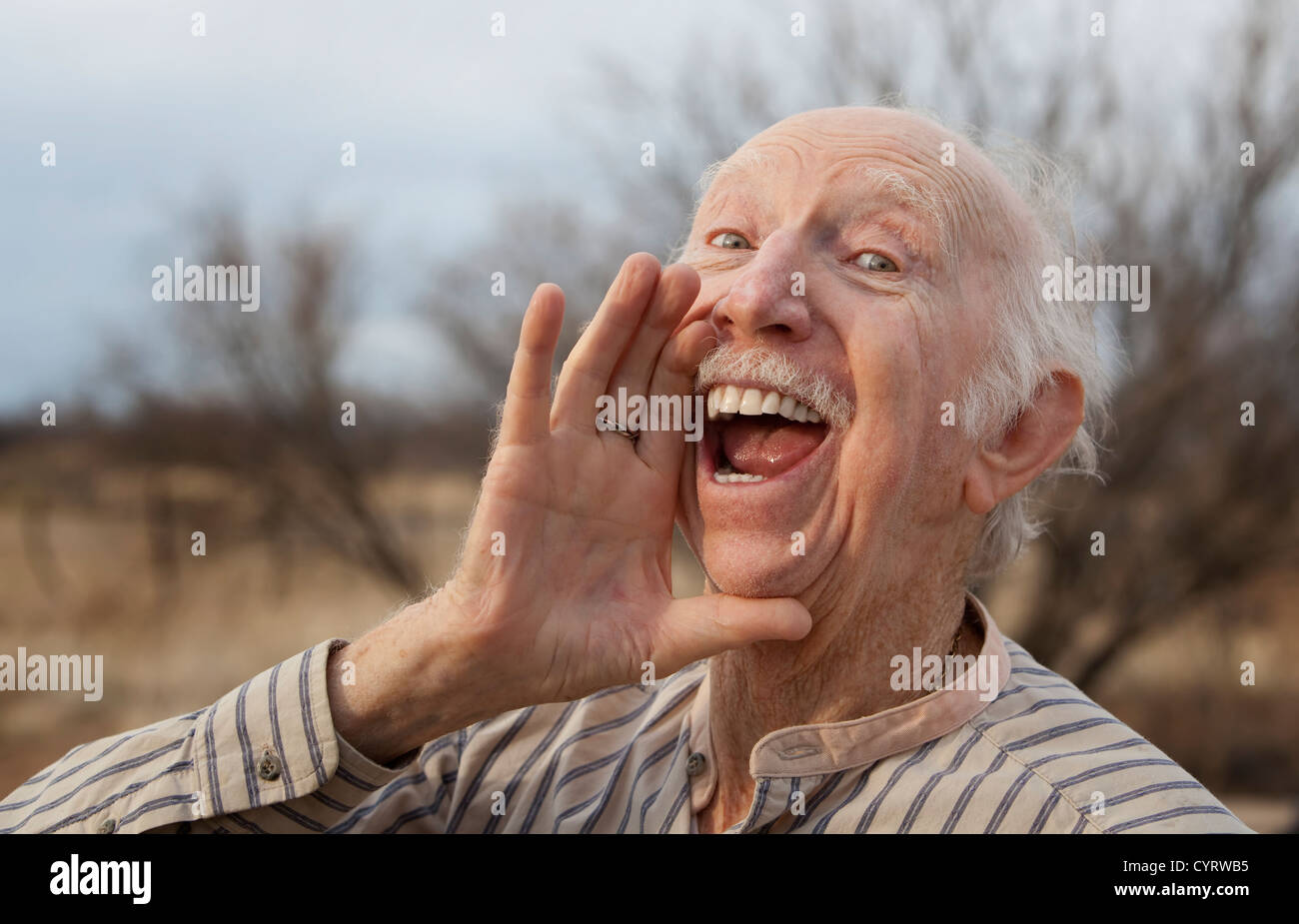 Senior Man Outdoors Calling Out A Message Stock Photo - Alamy