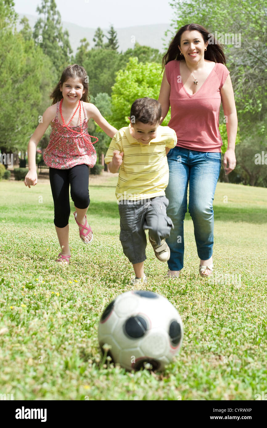 Family playing soccer and having fun, outdoor at the park Stock Photo ...