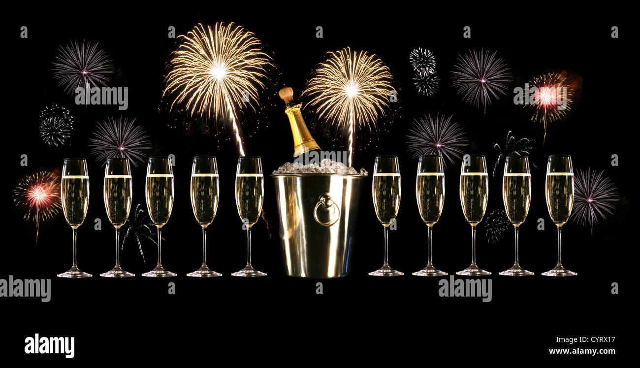 Glasses of champagne with silver ice bucket and fireworks Stock Photo ...