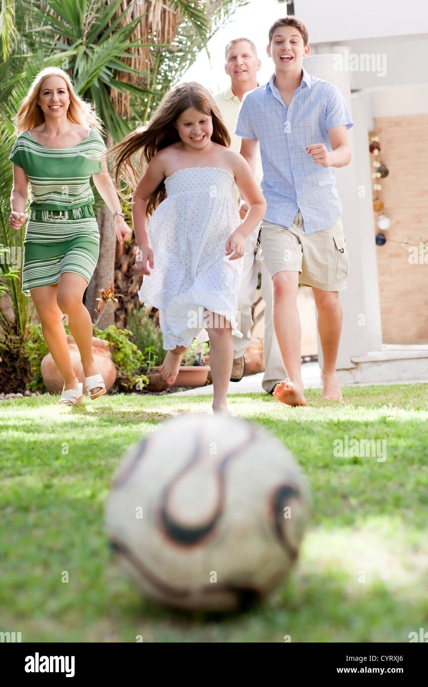 Children playing soccer in backyard hi-res stock photography and images ...