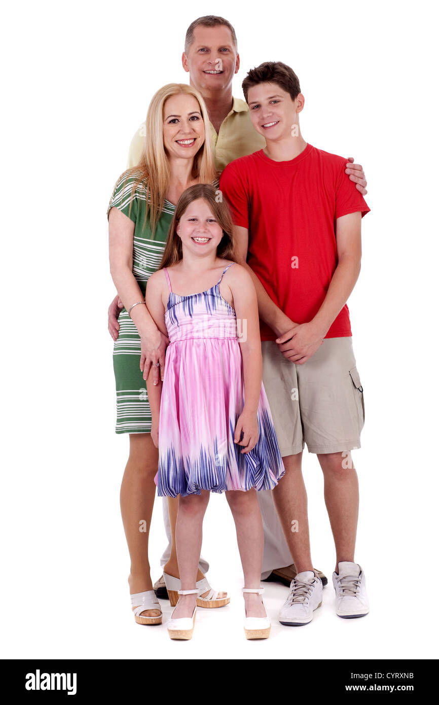 Happy family of four standind and looking at you over white background ...