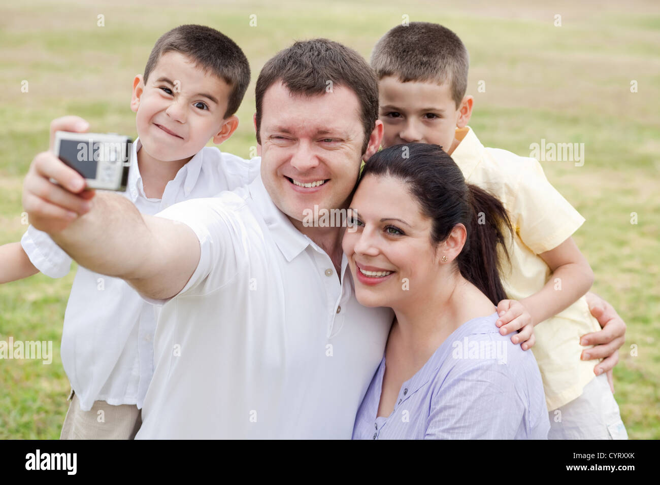 Cheerful family of five taking self portrait on natural background Stock Photo - Alamy