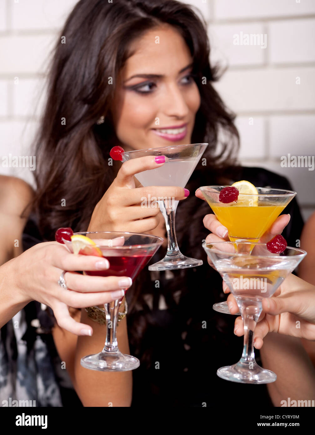 Beautiful woman cheersing in the cocktail party at disco club Stock ...