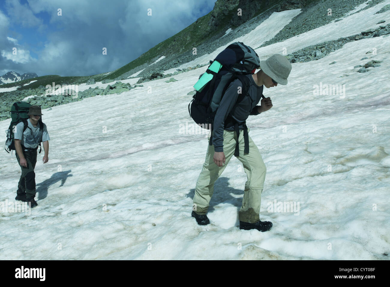 Backpackers on mountains lake Stock Photo - Alamy