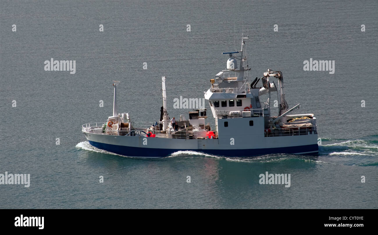 A small trawler at work Stock Photo - Alamy