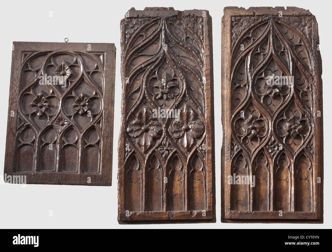 Three German or French Gothic Panels, around 1500 Carved oak with a ...