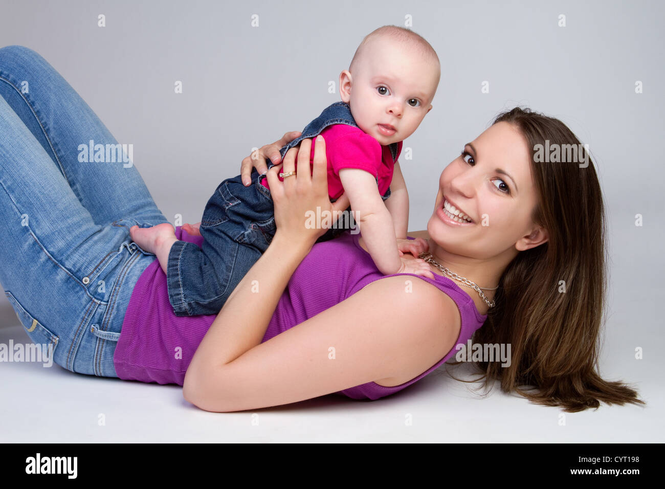 Smiling playing mother and child Stock Photo - Alamy