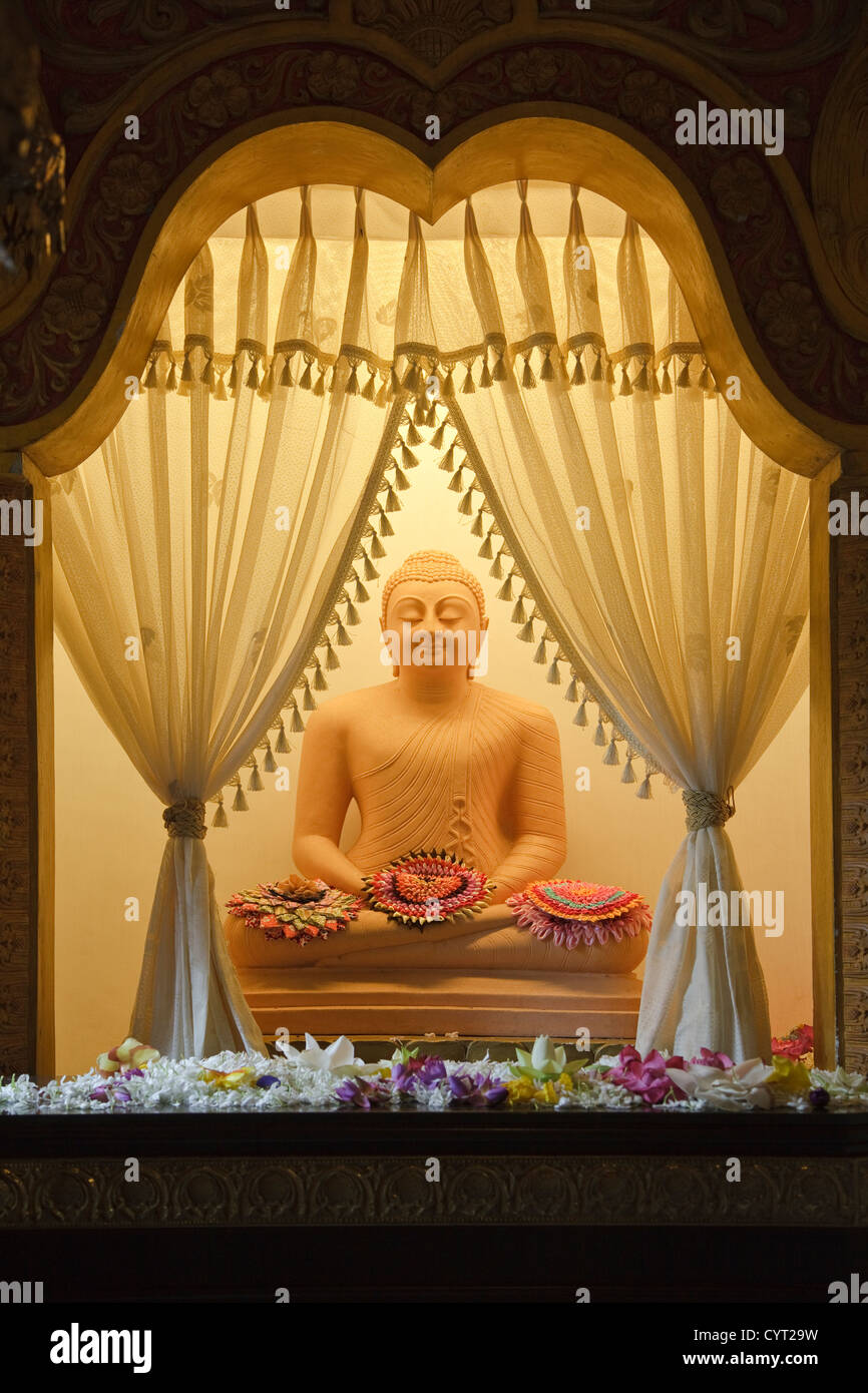 Buddha statue on display at the Temple of the Tooth, also known as Sri ...