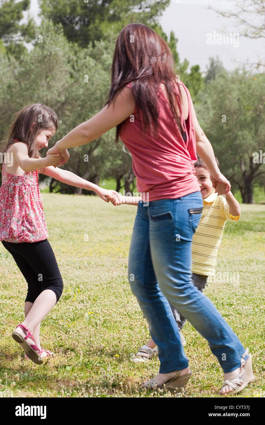 Happy family playing in the park, outdoor Stock Photo - Alamy