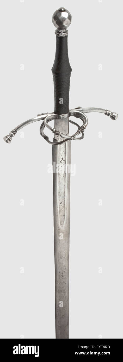 A German hand and a half sword,around 1540 A broad cutting blade with a ...