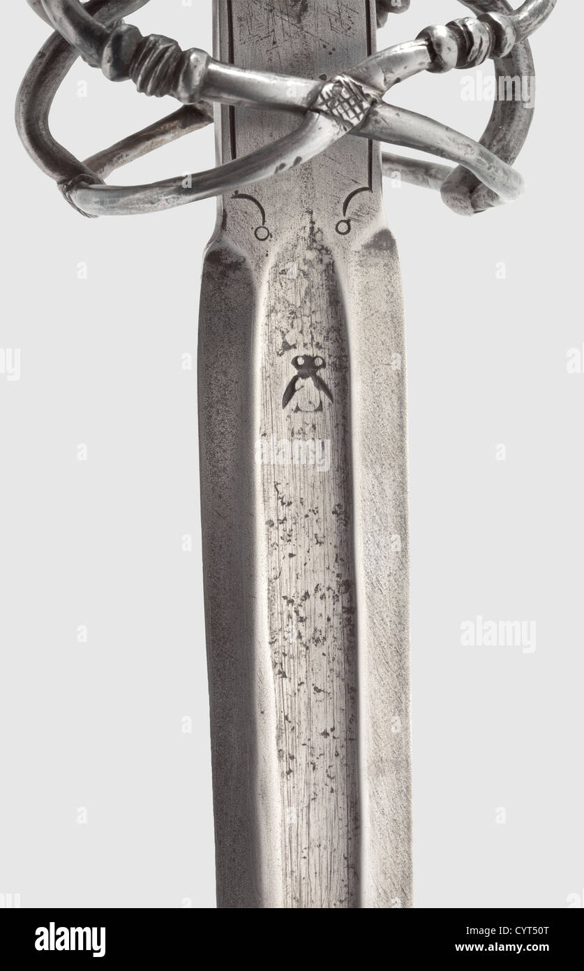 A German hand and a half sword,around 1540 A broad cutting blade with a ...