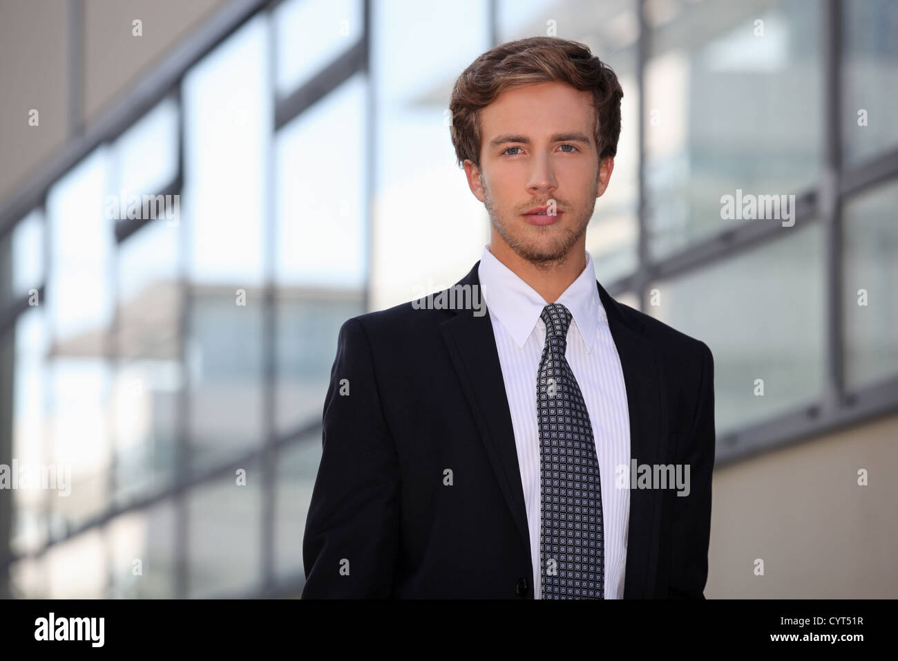 Young salesman in smart suit Stock Photo - Alamy