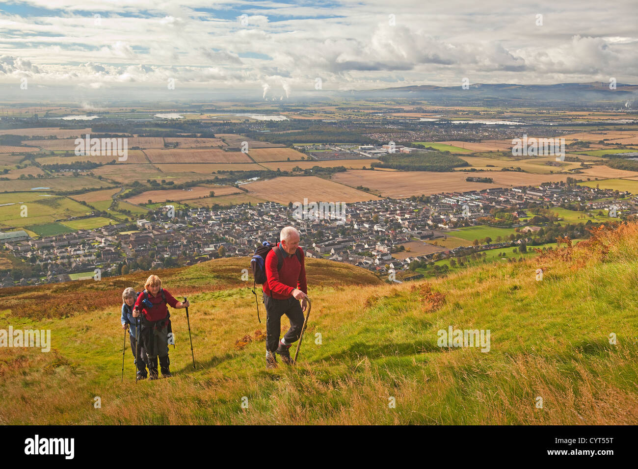 Walkers climbing The Nebit in the Ochil Hills above Alva Stock Photo ...