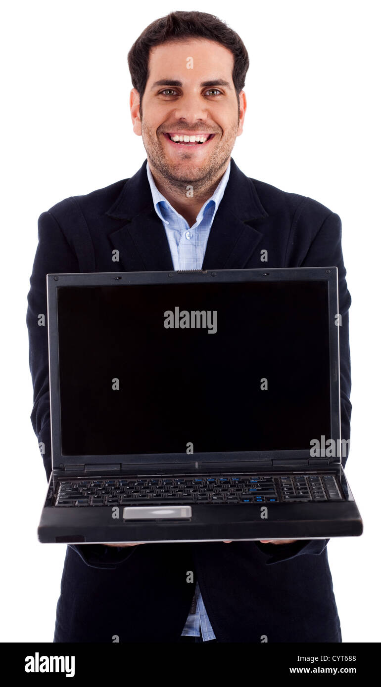 Portrait of young man holding laptop against an isolated background ...