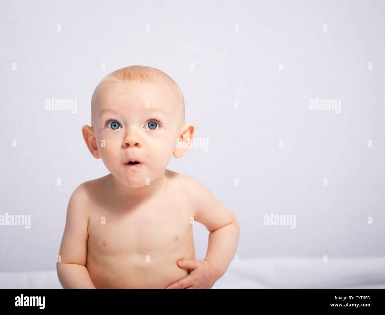 little baby makes a puzzled expression, her first photo session Stock ...