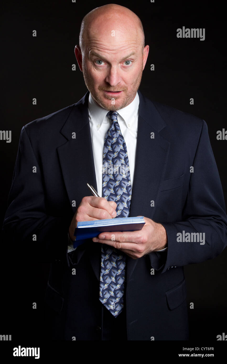 Man writing check Stock Photo - Alamy