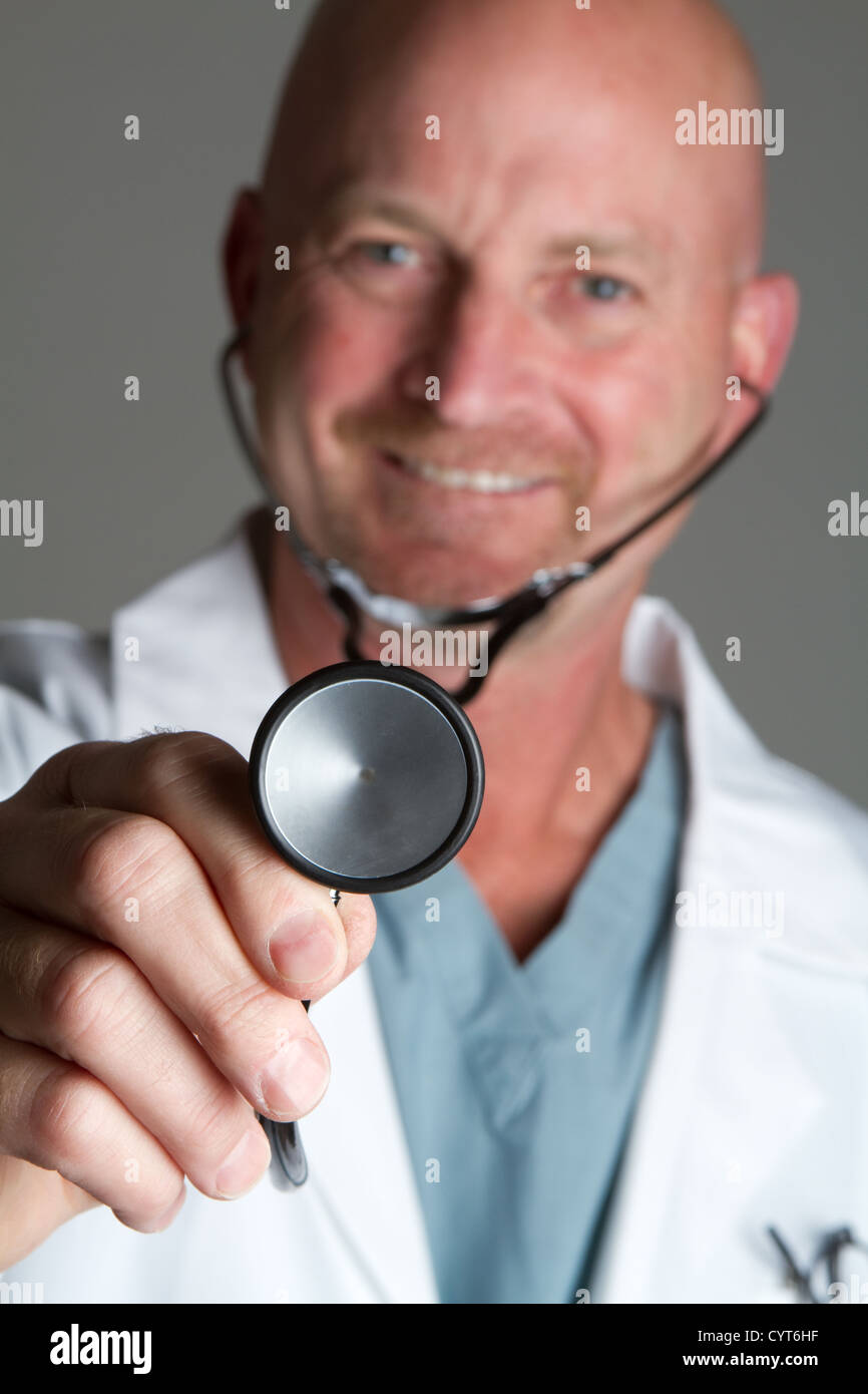 Smiling doctor holding stethoscope Stock Photo - Alamy Smiling doctor holding stethoscope Stock Photo - Alamy