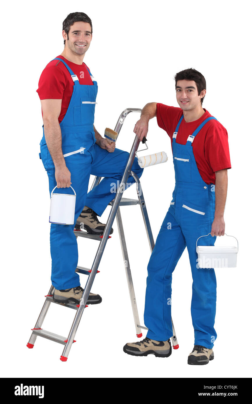 Two male decorators wearing matching outfits Stock Photo - Alamy