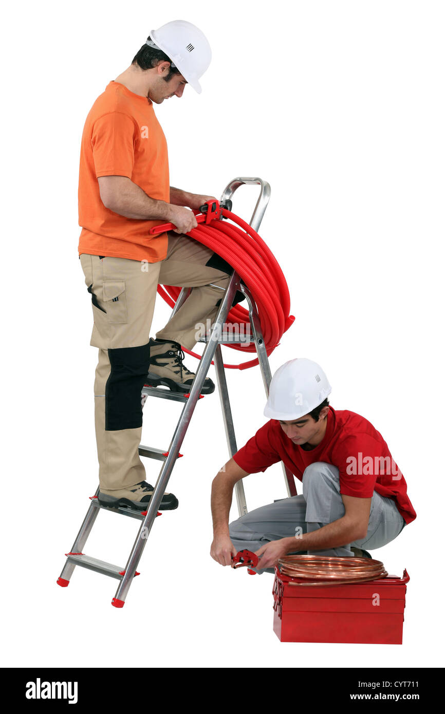 Tradesmen at work Stock Photo - Alamy