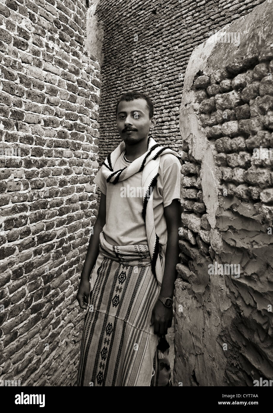 Man Standing In A Very Narrow Street, Zabid, Yemen Stock Photo - Alamy
