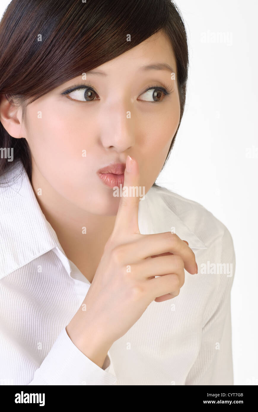 Closeup portrait of business woman with silent sign gesture on lips ...