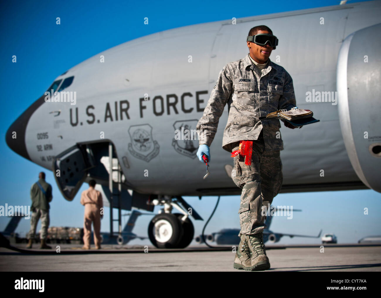 Airman 1st Class Monquavious Johnson walks toward a KC-135 Stratotanker ...