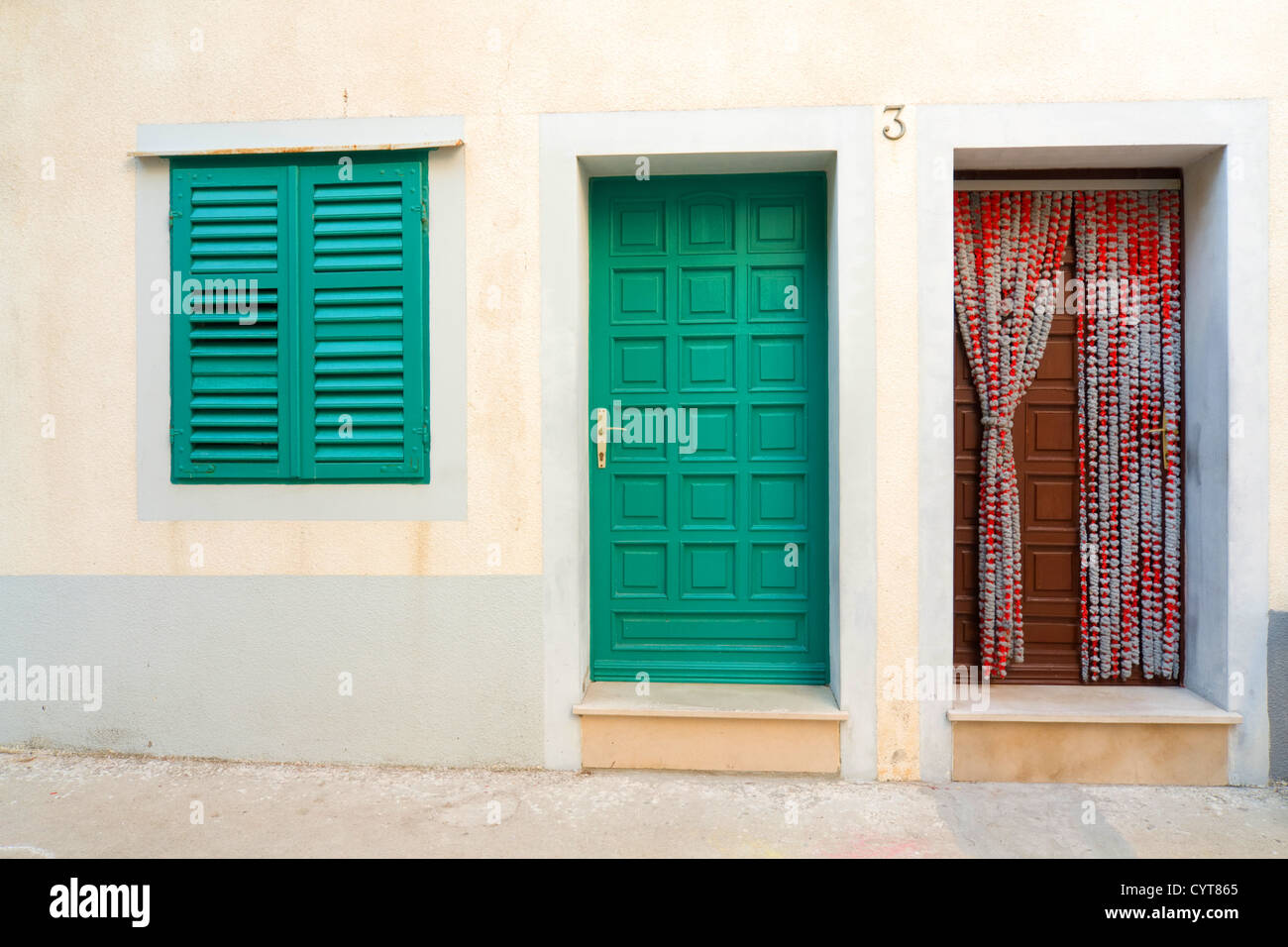 Two doors and window Stock Photo - Alamy