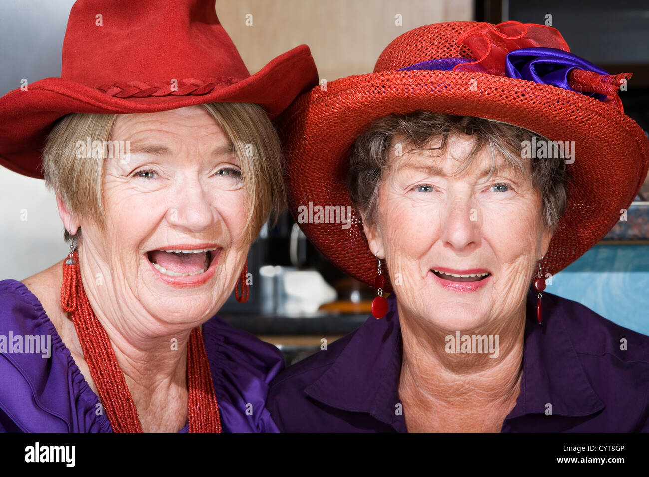 Women with red hats hi-res stock photography and images - Alamy