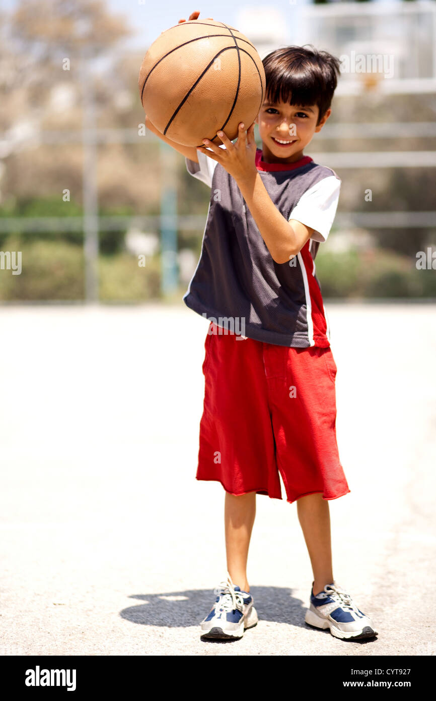 Adorable boy with basketball, outdoors Stock Photo - Alamy