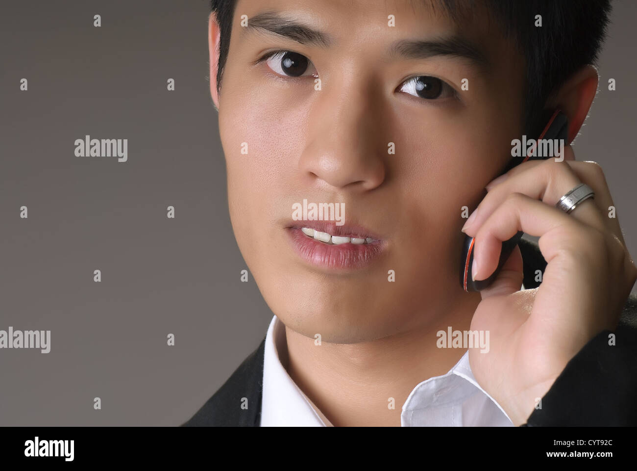 Business man with phone, closeup portrait with face Stock Photo - Alamy