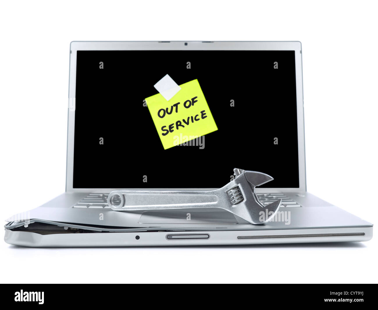 Damaged laptop with a post-it saying Out of Service and a spanner over ...