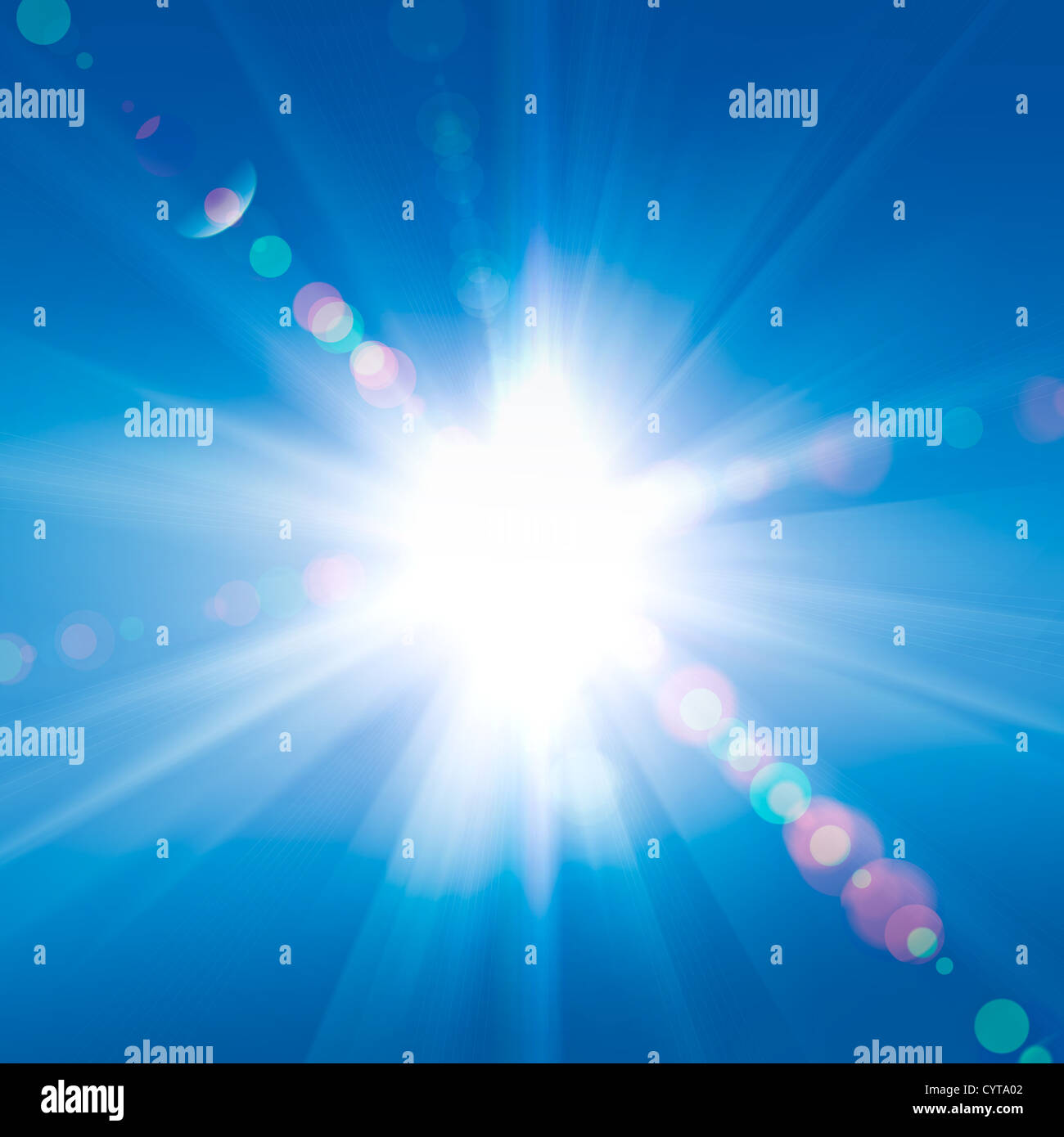 Sun rays against a blue sky Stock Photo - Alamy