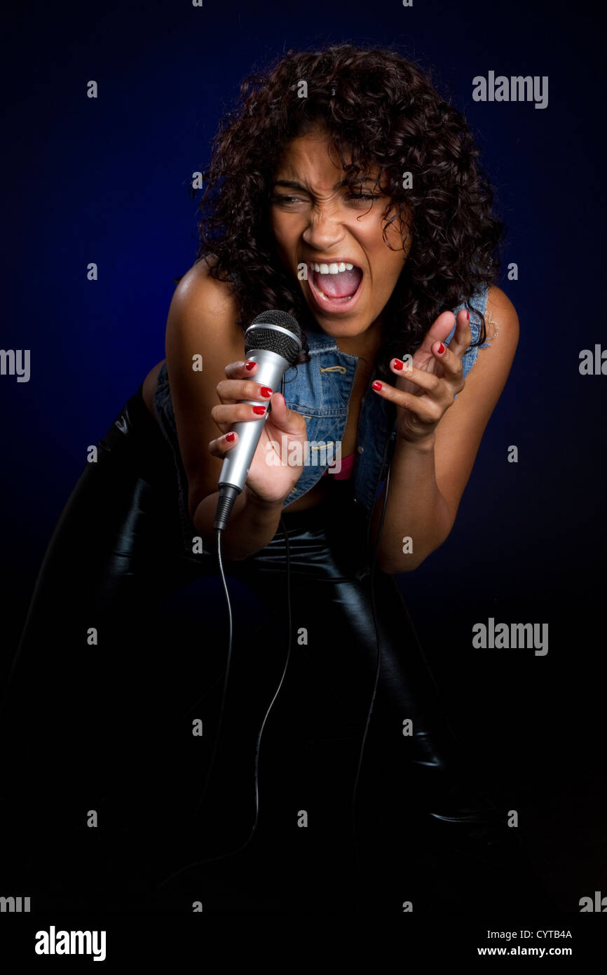 Singing african american rock star Stock Photo - Alamy